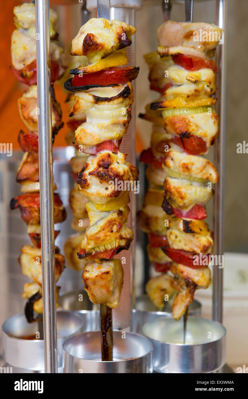 Cooking meat in a homemade electric barbeque Stock Photo - Alamy