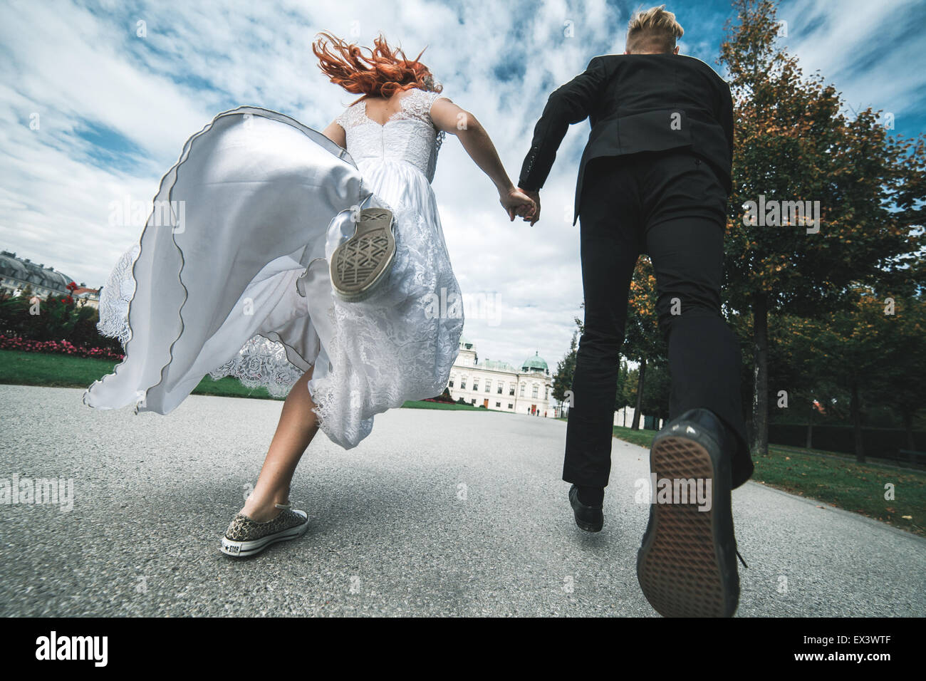 Wedding couple on a walk Stock Photo - Alamy