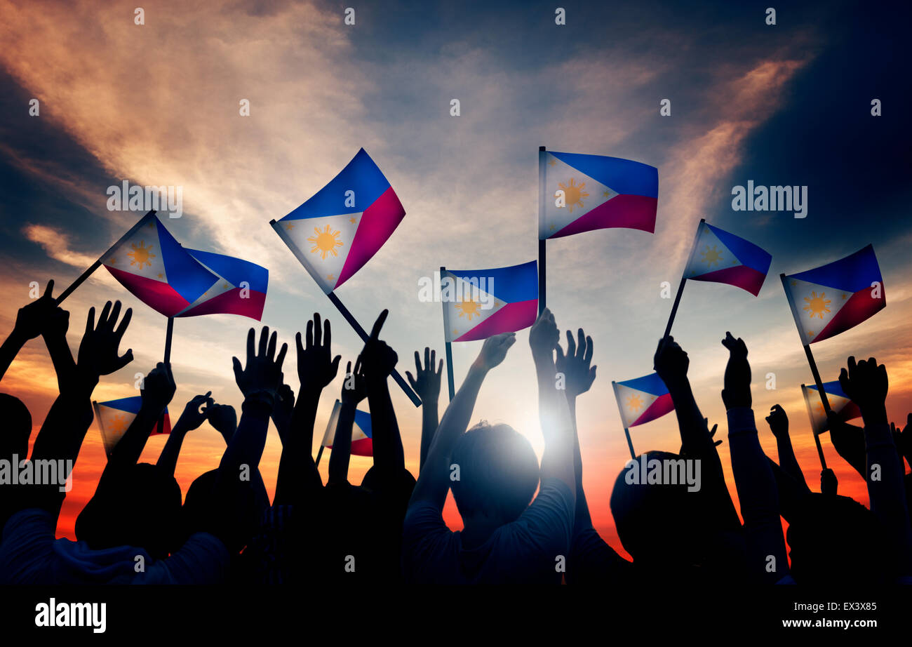 Group of People Waving Filipino Flags in Back Lit Stock Photo - Alamy
