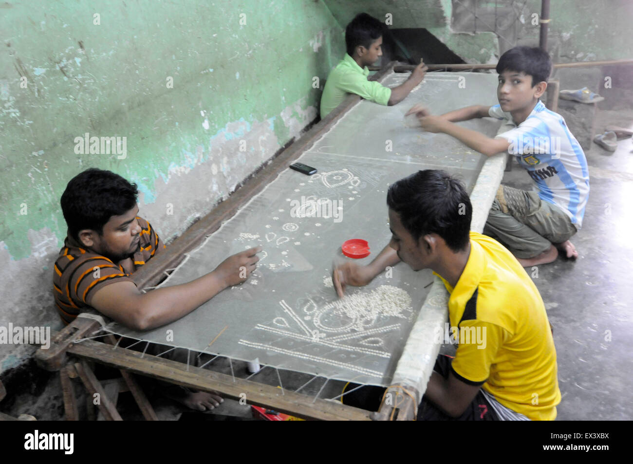 Dhaka, Bangladesh. 6th July, 2015. People make handmade embroidery on ...