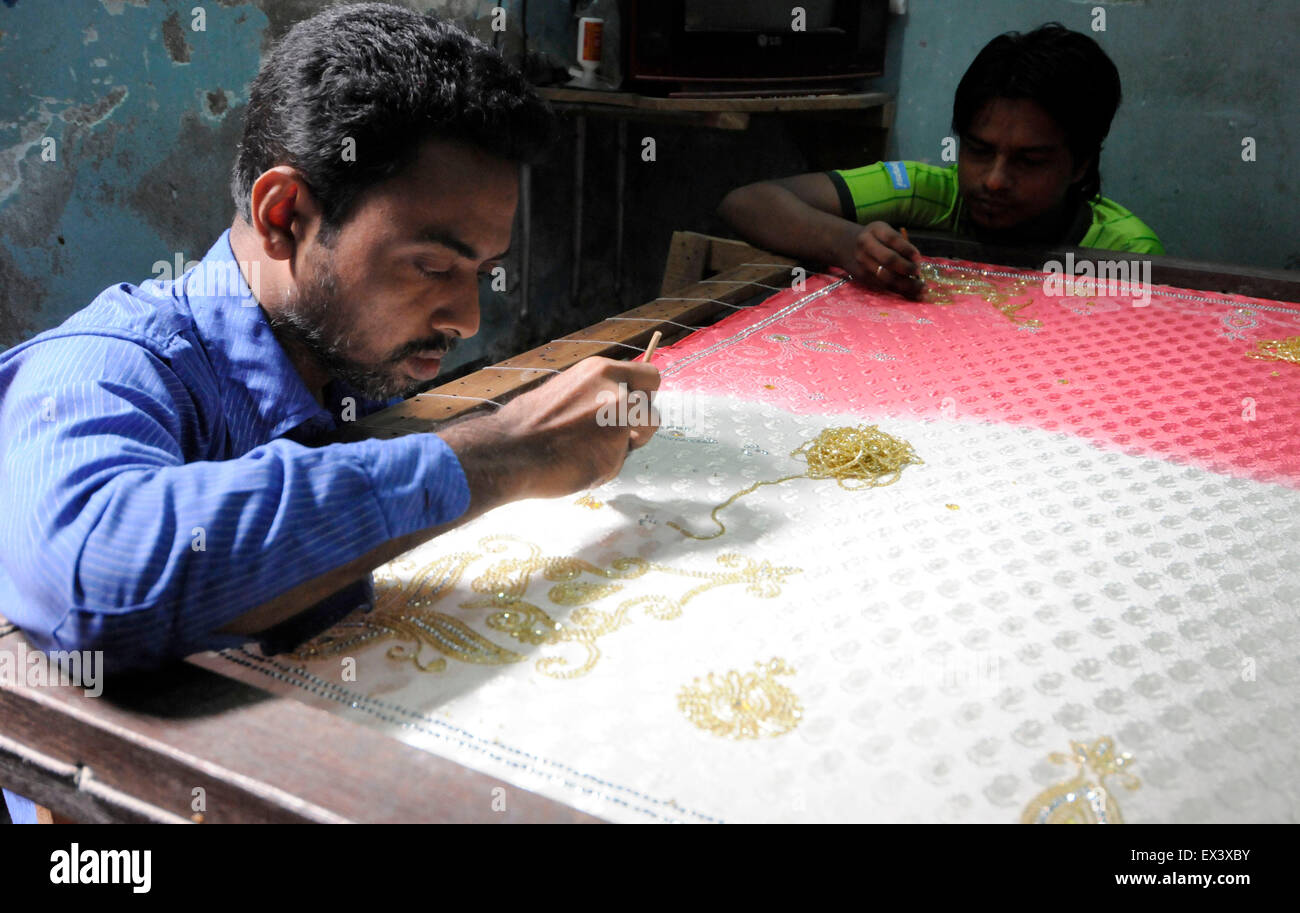 Dhaka, Bangladesh. 6th July, 2015. People make handmade embroidery on ...