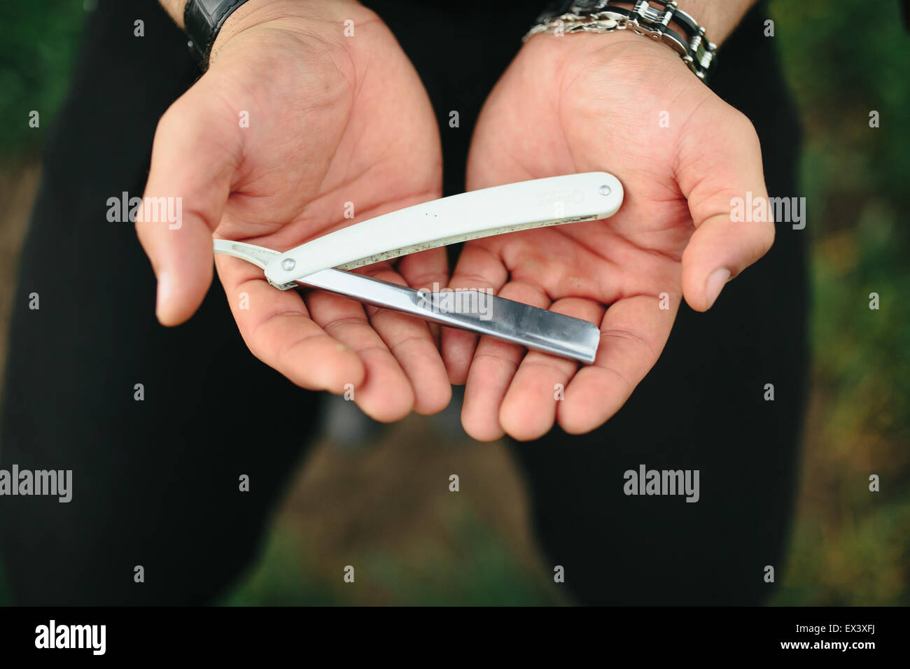 ancient blade in the hands of men Stock Photo - Alamy