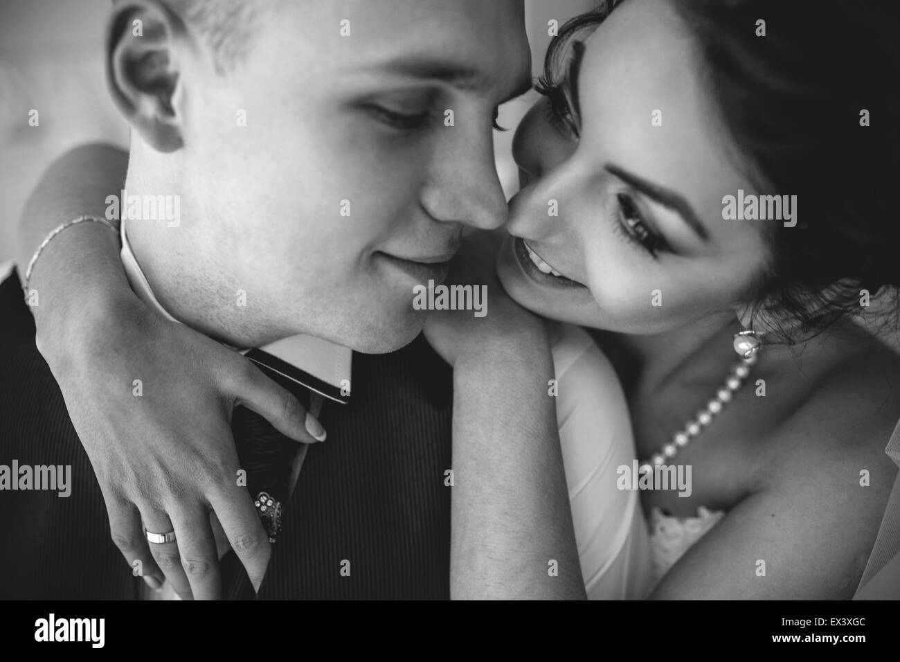 Beautiful European bridal couple in the hotel room Stock Photo - Alamy