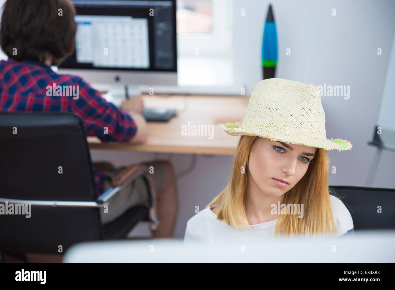 Beautiful young girl working in office Stock Photo - Alamy