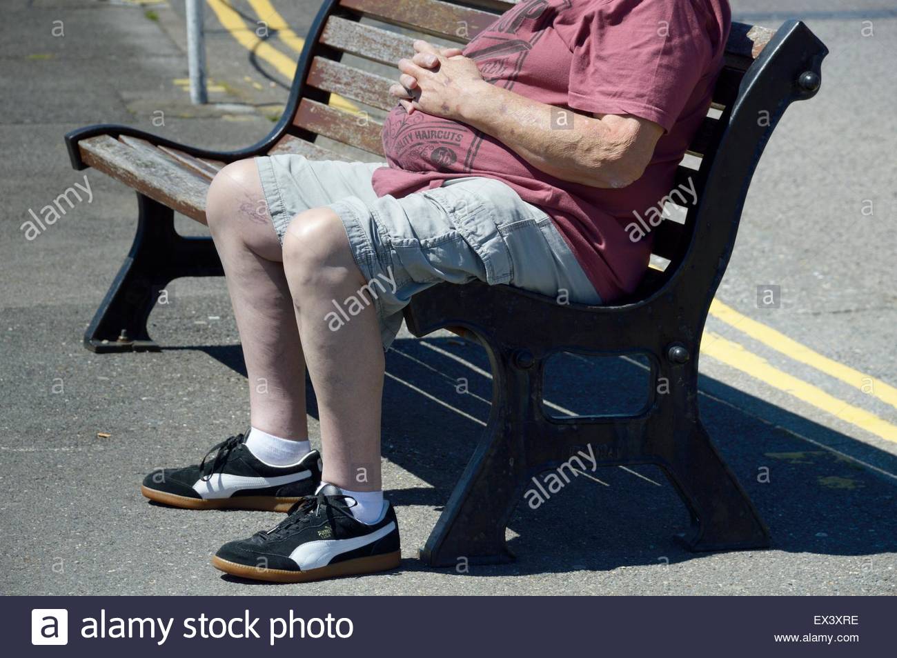 Fat Man Sitting On Bench Stock Photos & Fat Man Sitting On Bench Stock ...