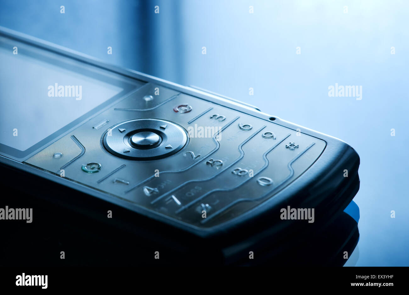 Mobile phone close-up shot. Toned in blue Stock Photo - Alamy
