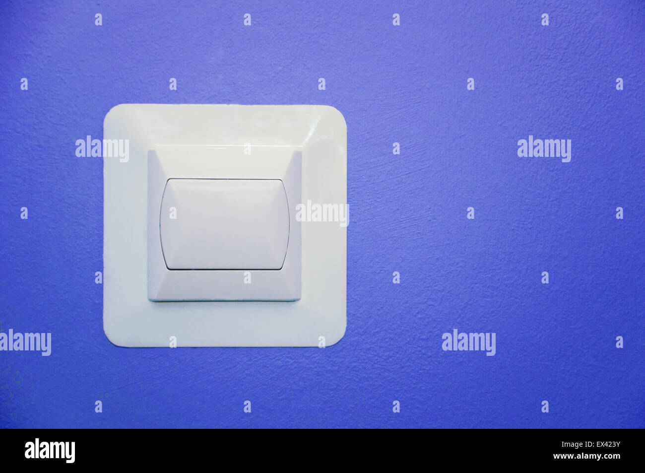 white switch on the blue wall Stock Photo - Alamy