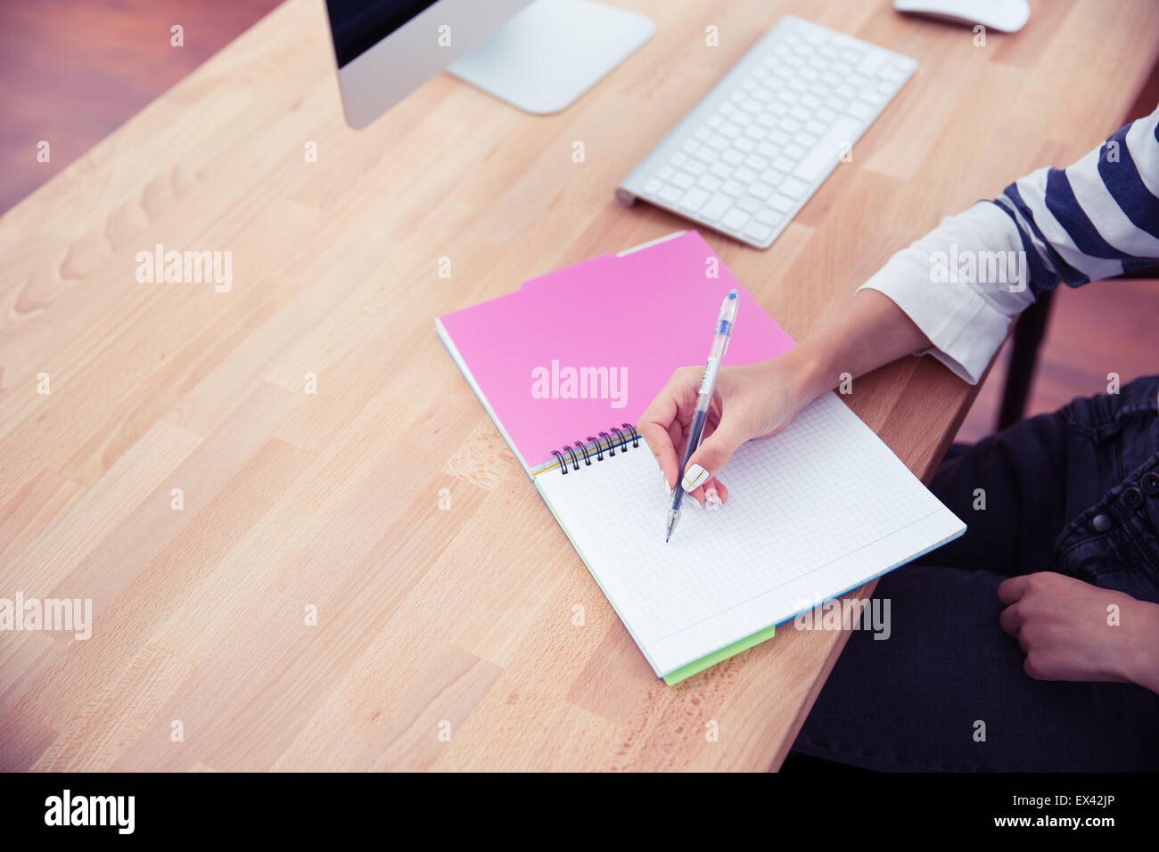Closeup portrait of a girl writing notes in office Stock Photo - Alamy