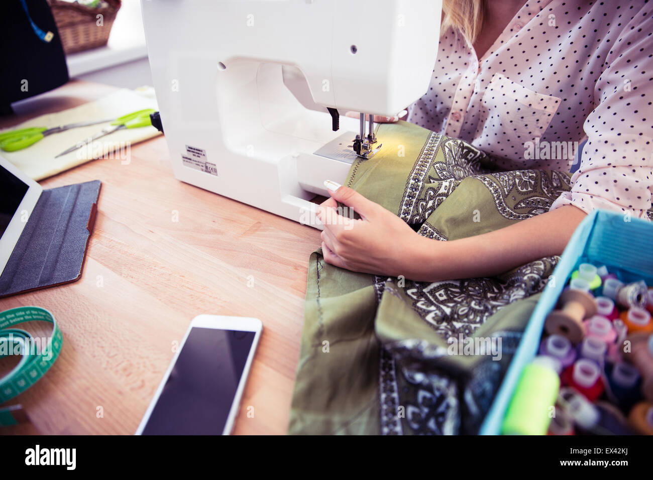 Smiling woman using sewing machine hi-res stock photography and images ...