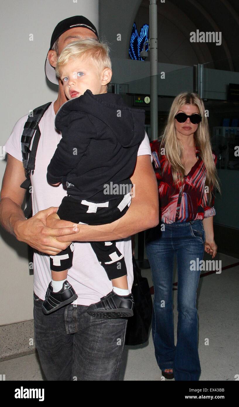 Fergie, her husband Josh and their son Axl at Los Angeles International ...