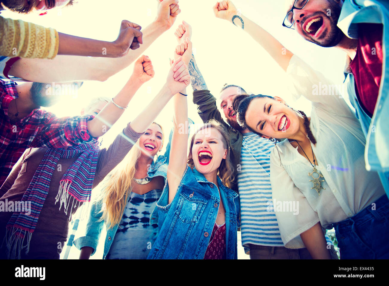 Friendship huddle happiness beach hi-res stock photography and images ...