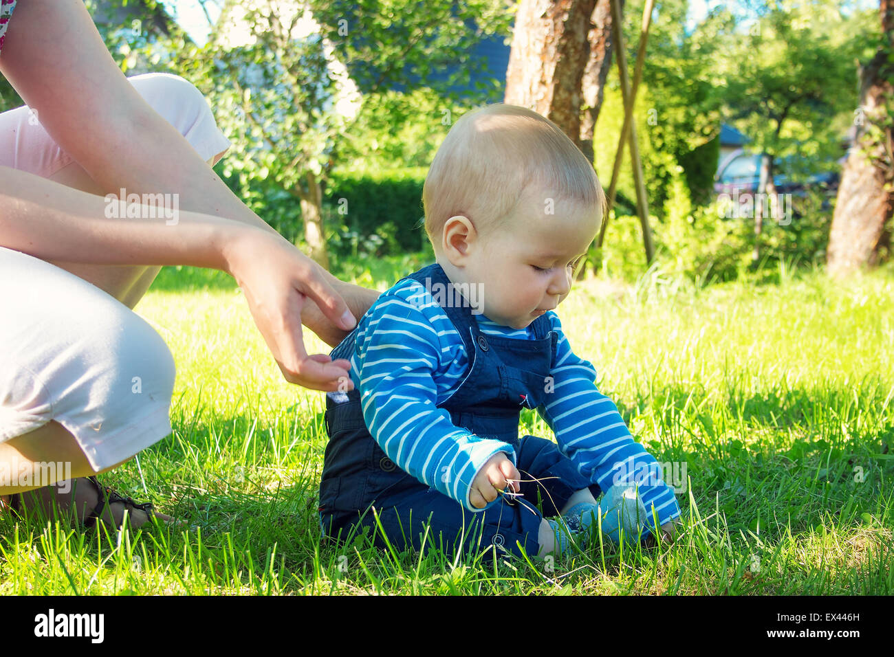 Baby child playing garden mother hi-res stock photography and images ...