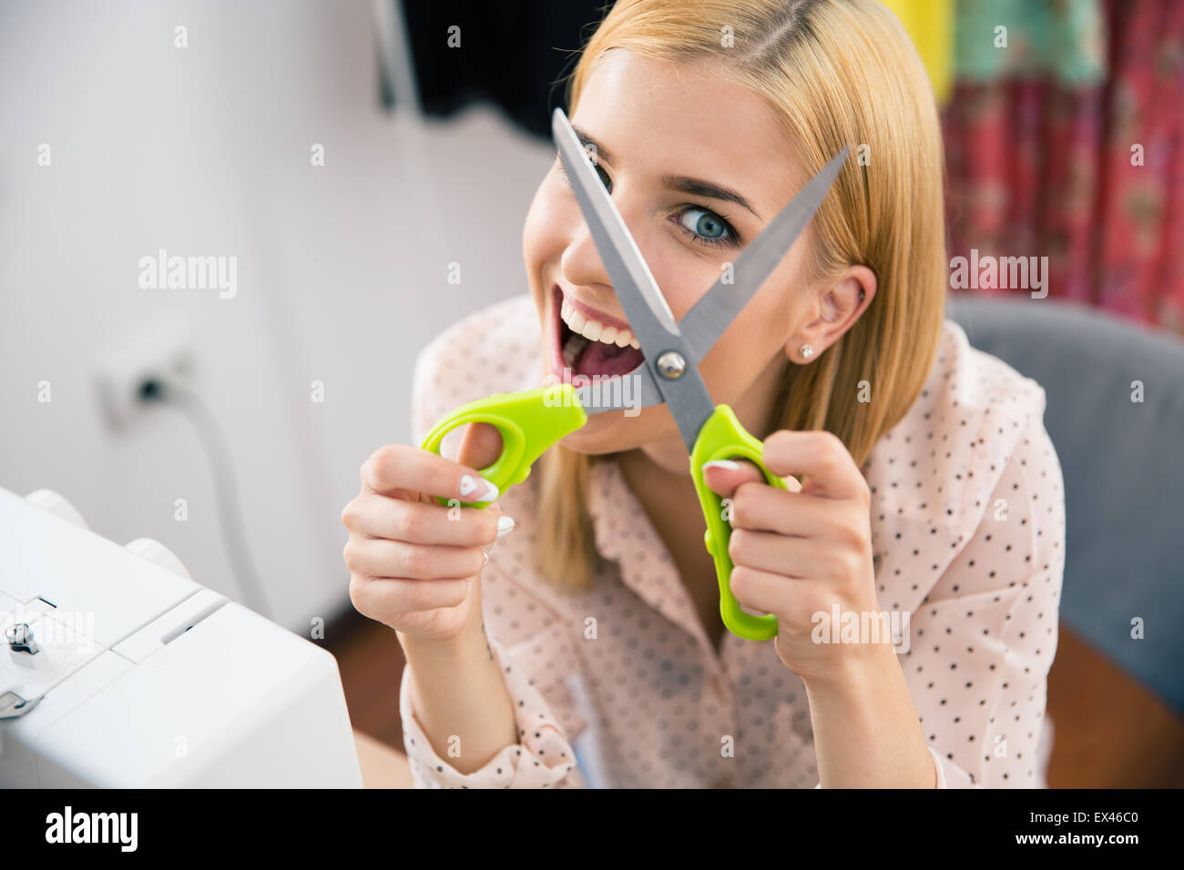 Holding scissors hi-res stock photography and images - Alamy