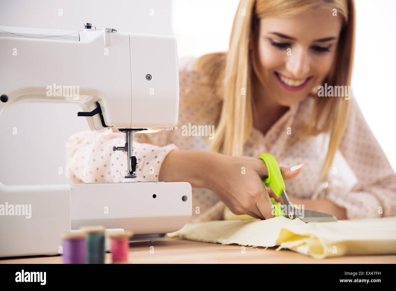 Cutting cloth tailor hi-res stock photography and images - Alamy