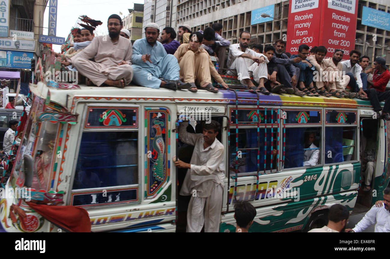 Citizens drag to travel on an overloaded bus as the residents of ...