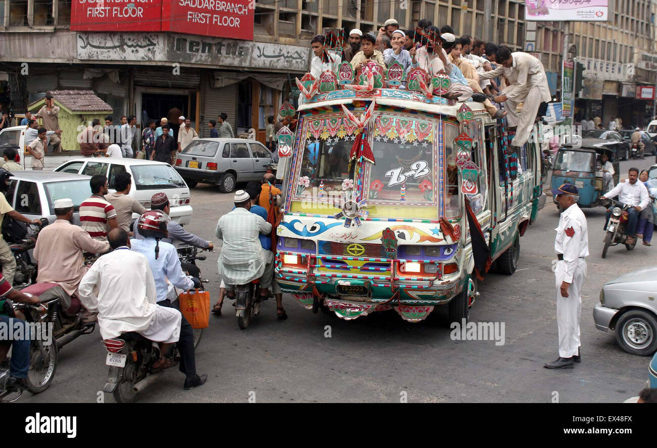 Citizens drag to travel on an overloaded bus as the residents of ...