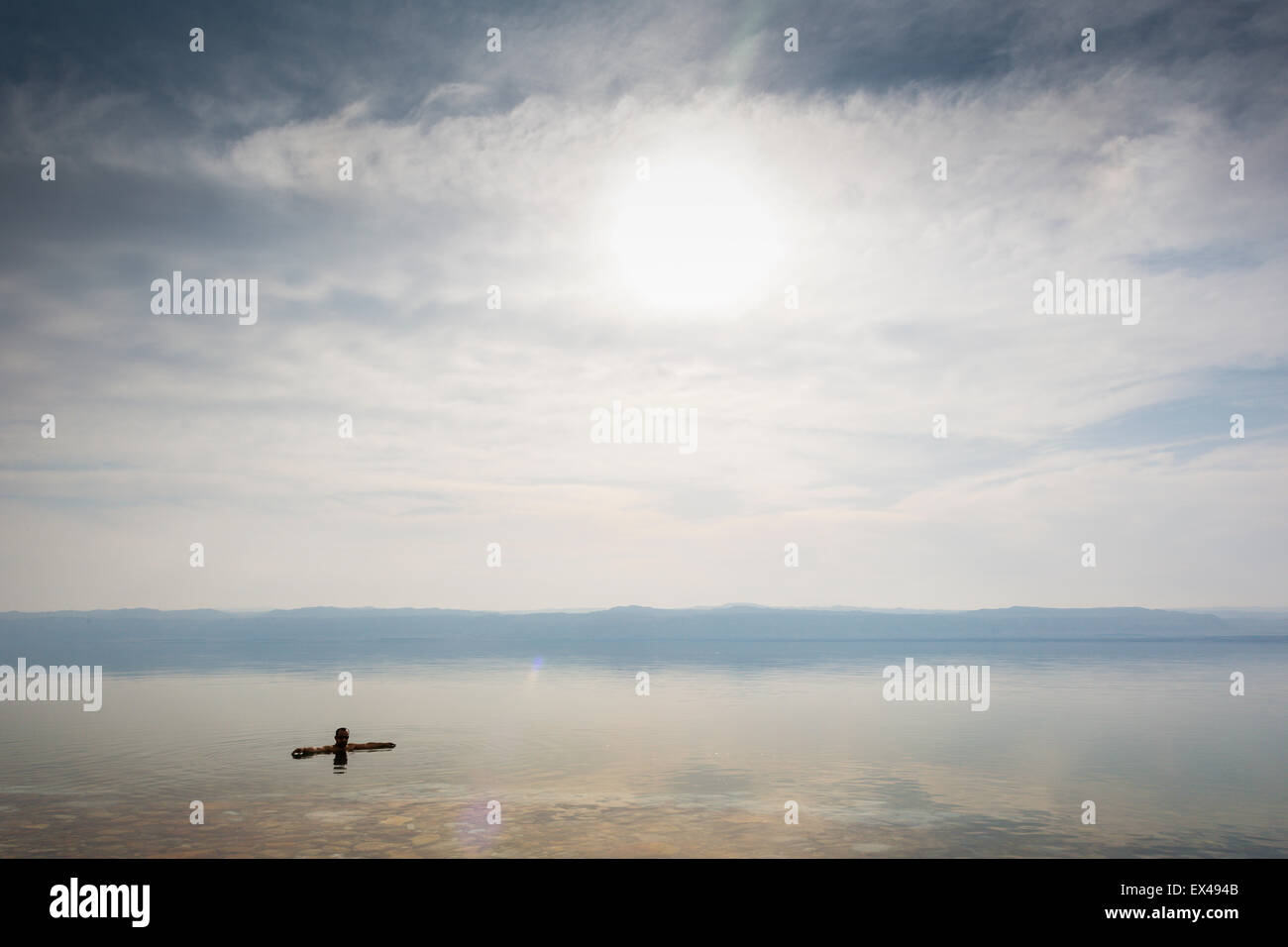 The Dead Sea, Jordan. Individual male tourist floating with his arms ...