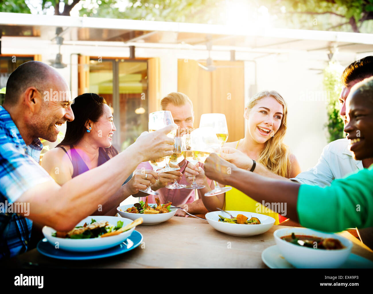 Friends drinking champagne cheers hi-res stock photography and images ...