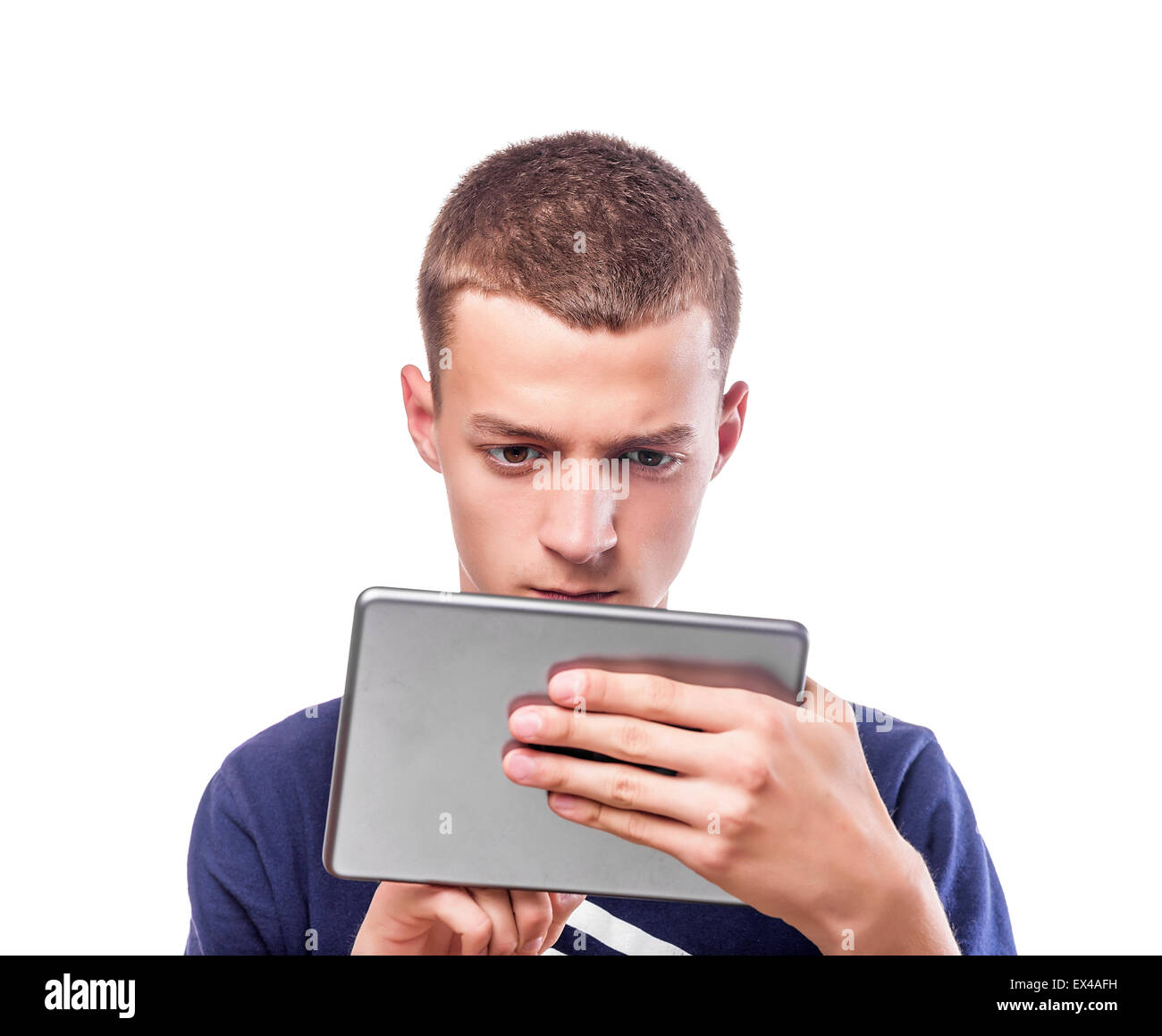 Young man using tablet pc Stock Photo - Alamy