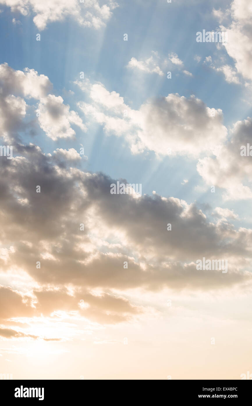 Clouds and sunrays at sunrise Stock Photo - Alamy