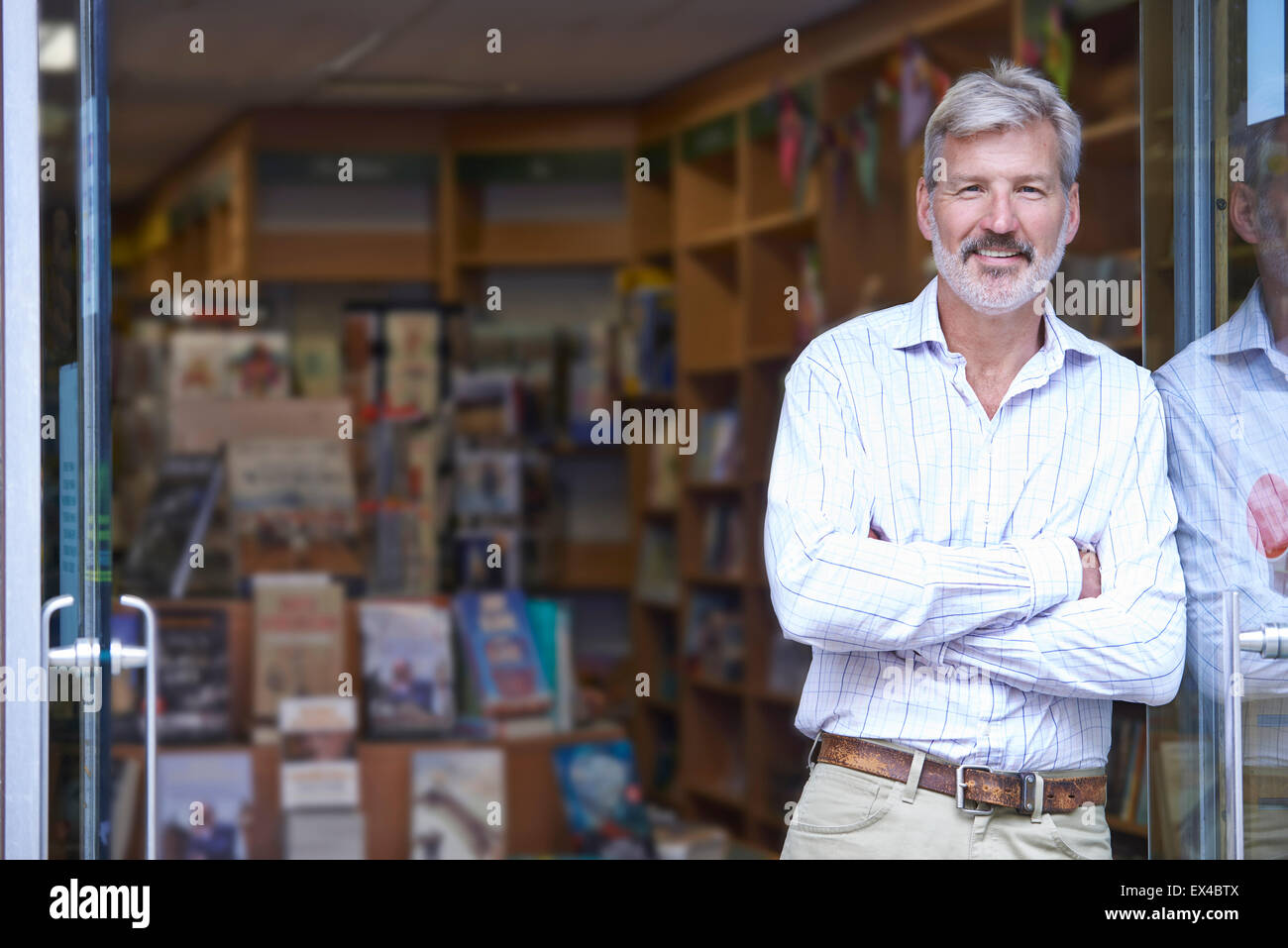 Portrait Of Male Bookshop Owner Outside Store Stock Photo - Alamy