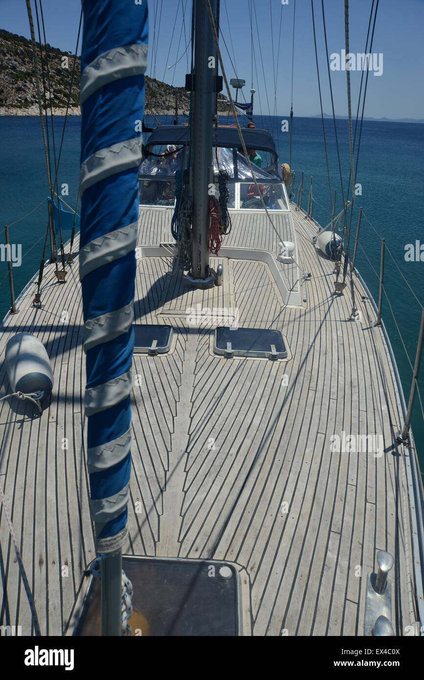 wooden deck of 50 foot ketch with self furling jib Stock Photo - Alamy