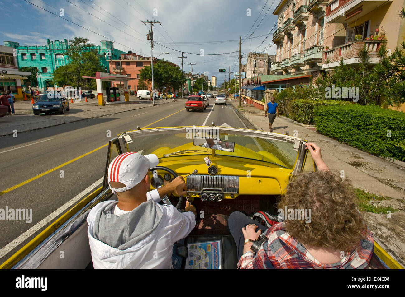 Horizontal streetview driving through Havana in a Chevrolet convertible ...
