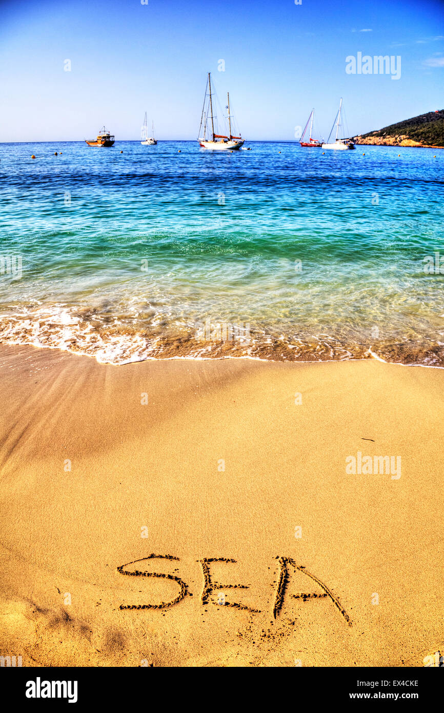 Holidays written in the sand hi-res stock photography and images - Alamy