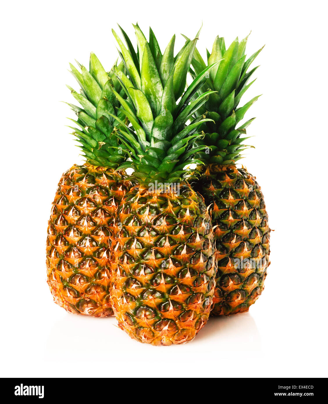 three ripe pineapple on the white background Stock Photo - Alamy