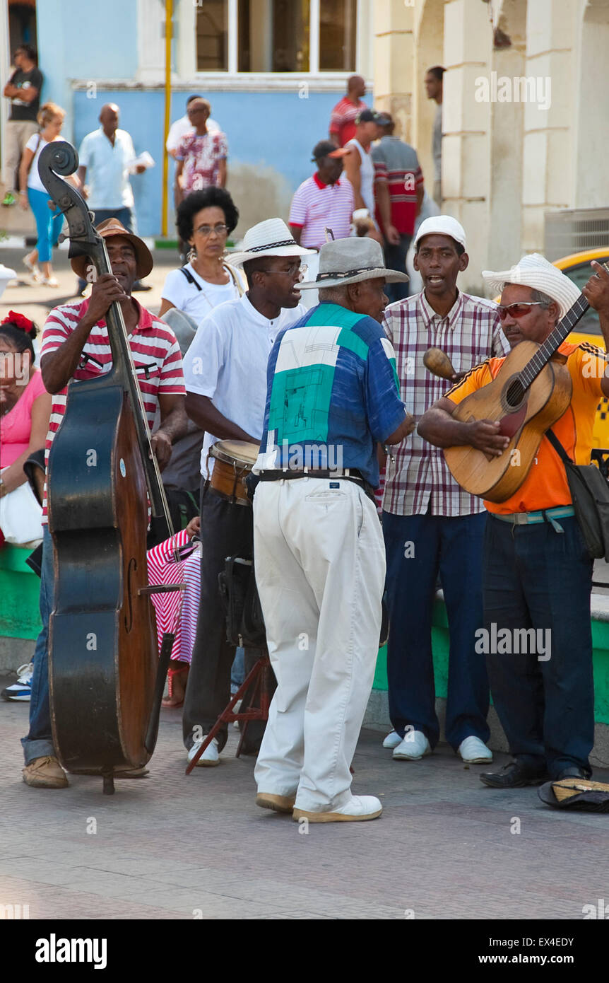 Vertical view of a typical salsa group busking on the streets of ...