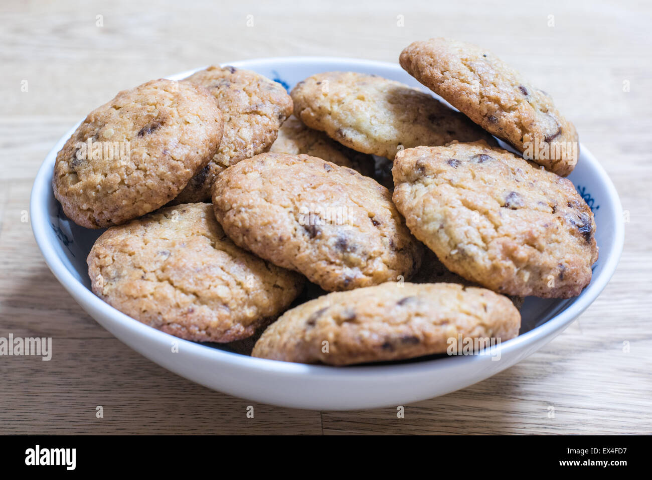 A white bowl full of home made chocolate chip cookies Stock Photo - Alamy