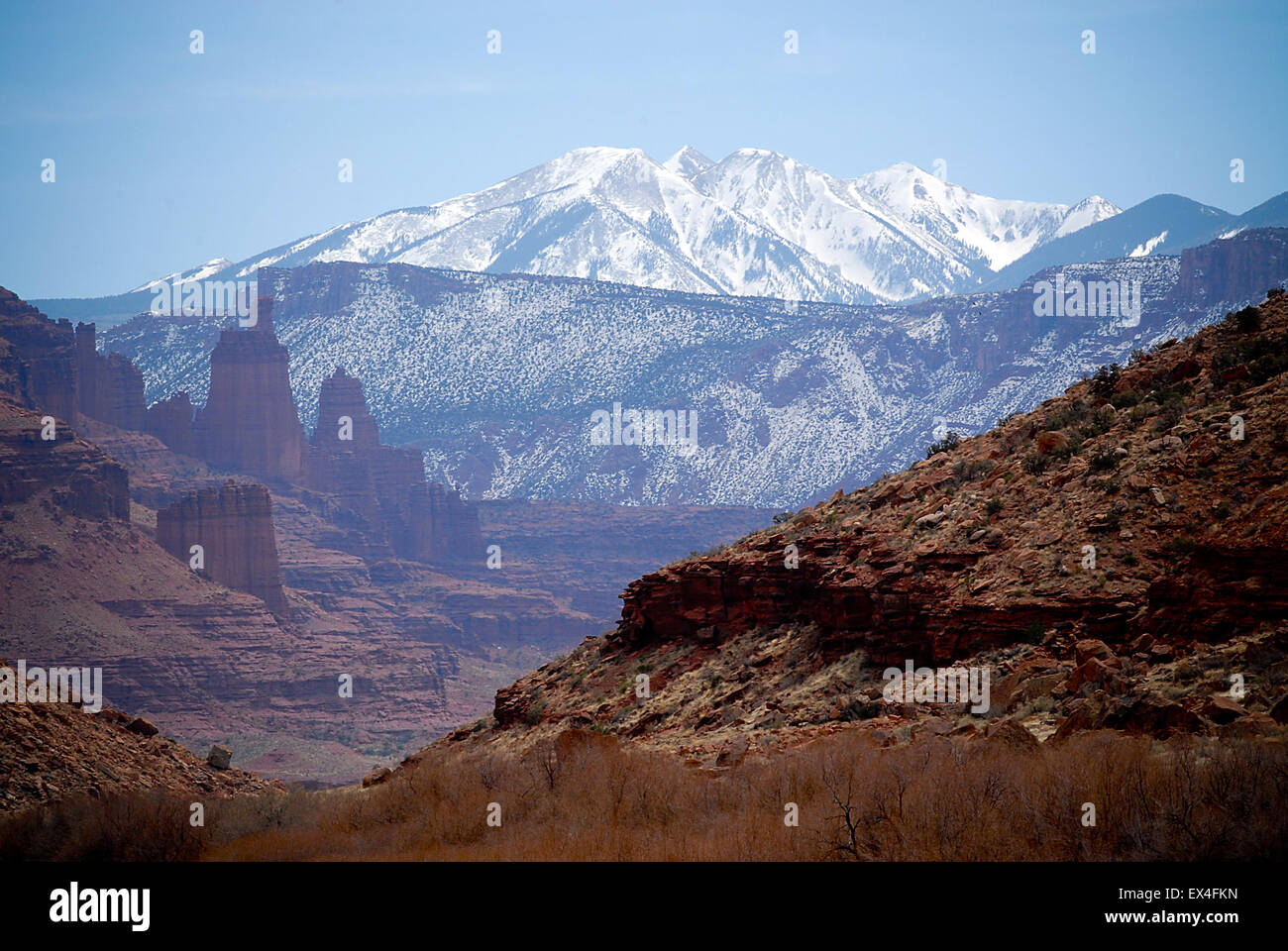 The snowcapped La Sal Mountains overlook the red sandstone of the Utah ...