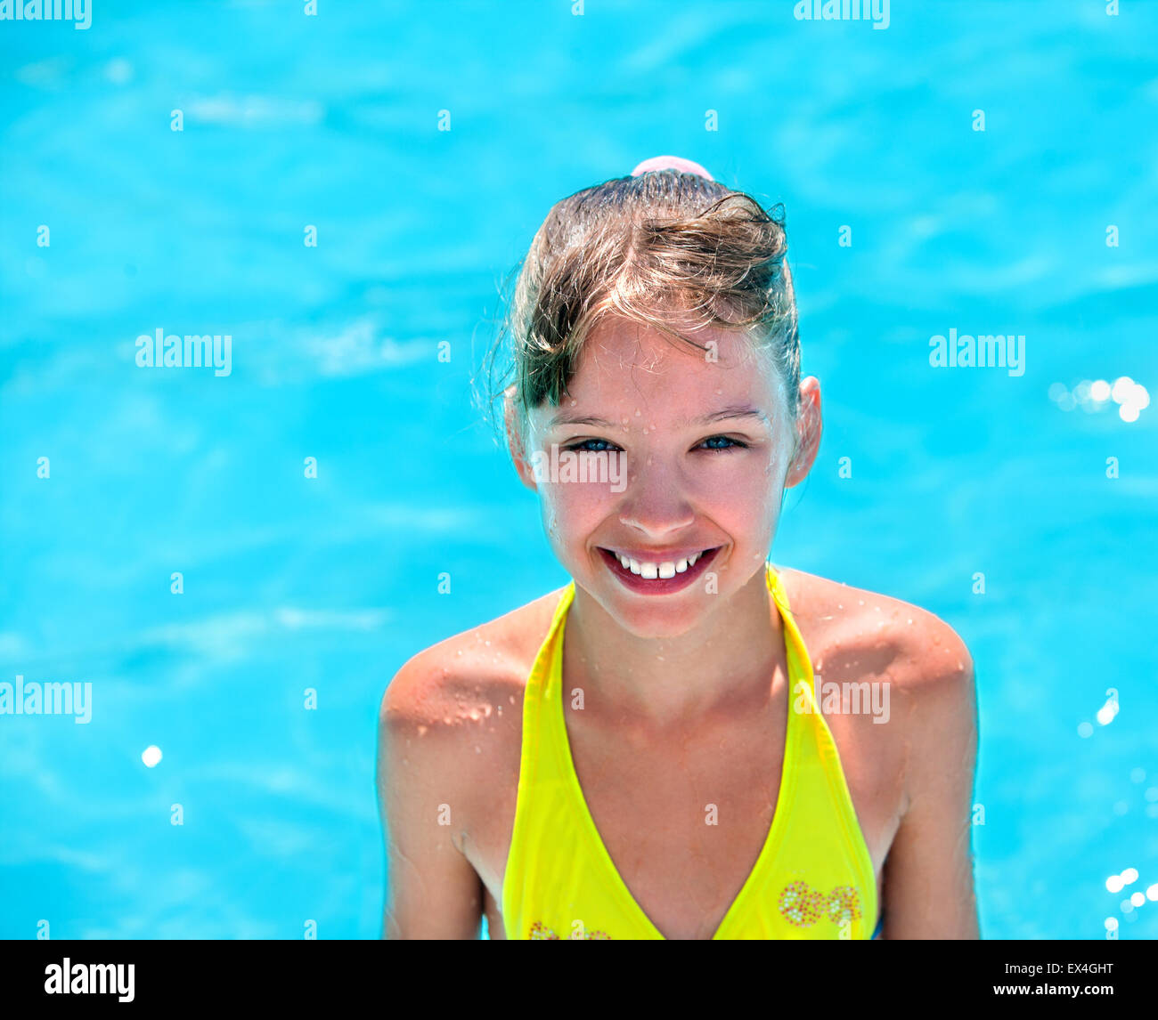 Kid wearing yellow bikini in swimming pool Stock Photo - Alamy