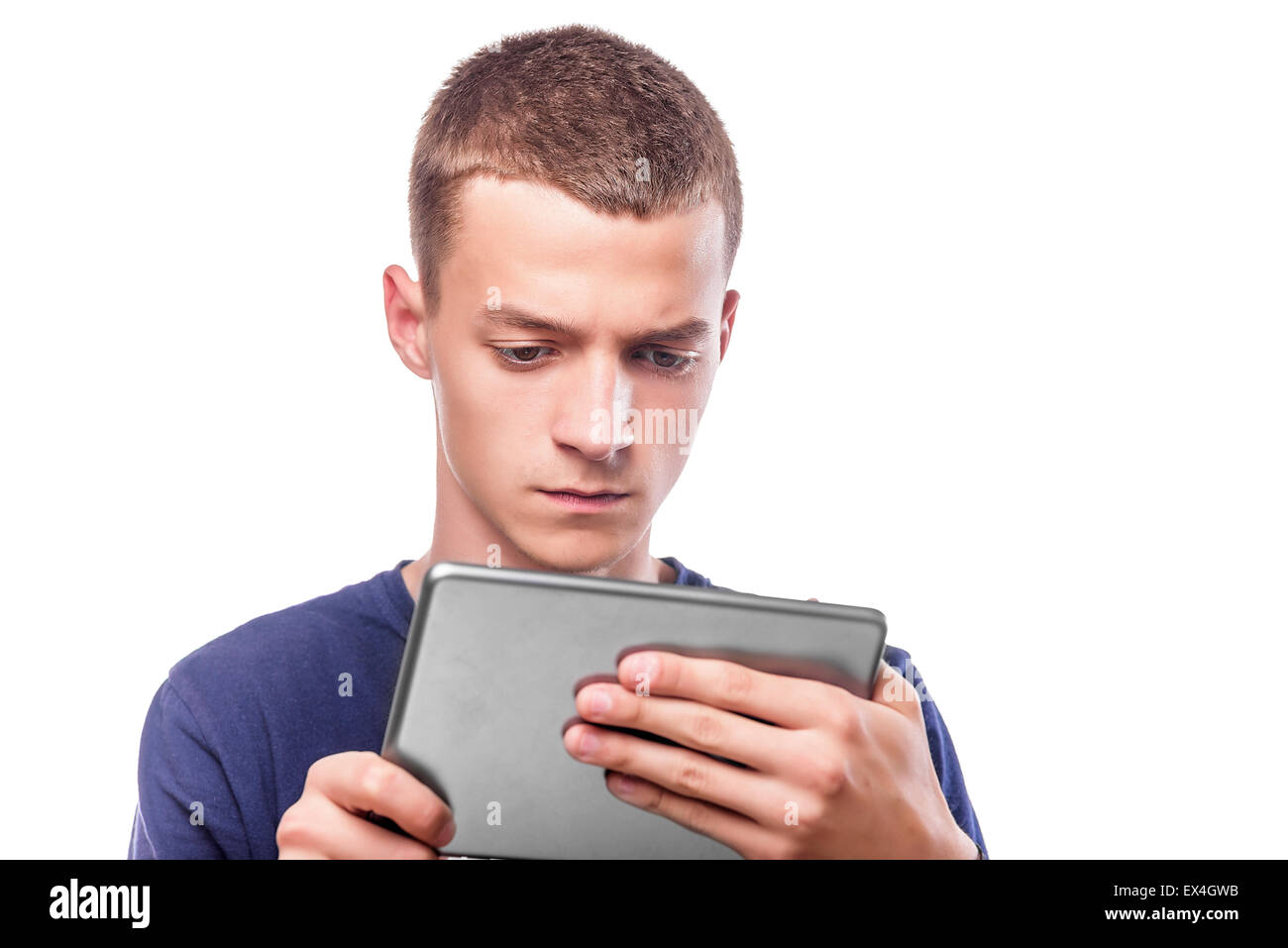 Young man using tablet pc Stock Photo - Alamy