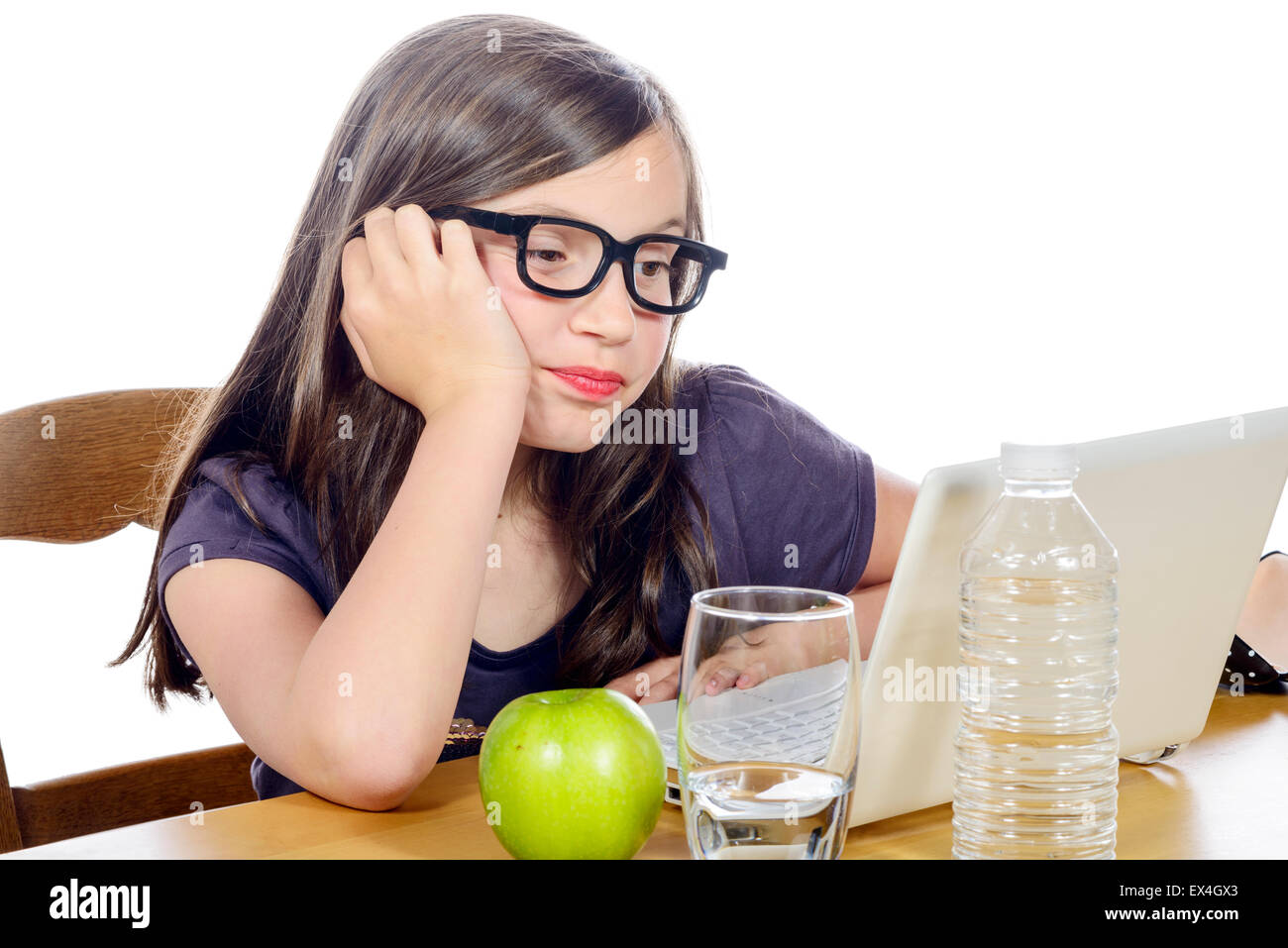a little girl doing her homework on her computer on white Stock Photo ...