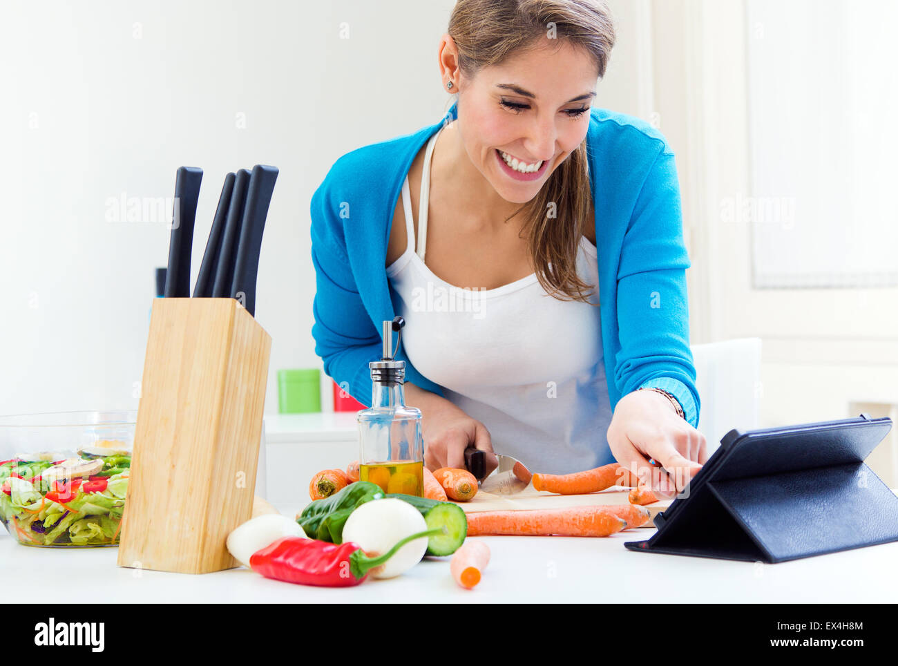 Happy woman looking recipe hi-res stock photography and images - Alamy