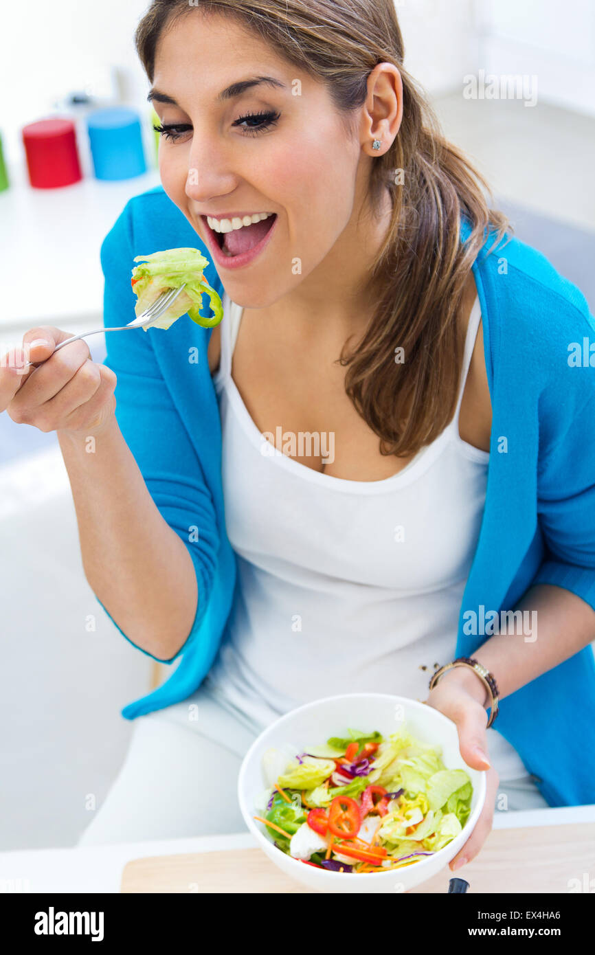 Attractive brunette woman eating salad hi-res stock photography and ...