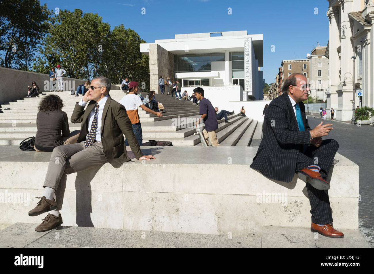 Italian men on suit sitting by the Ara Pacis Augustae on Piazza Augusto ...