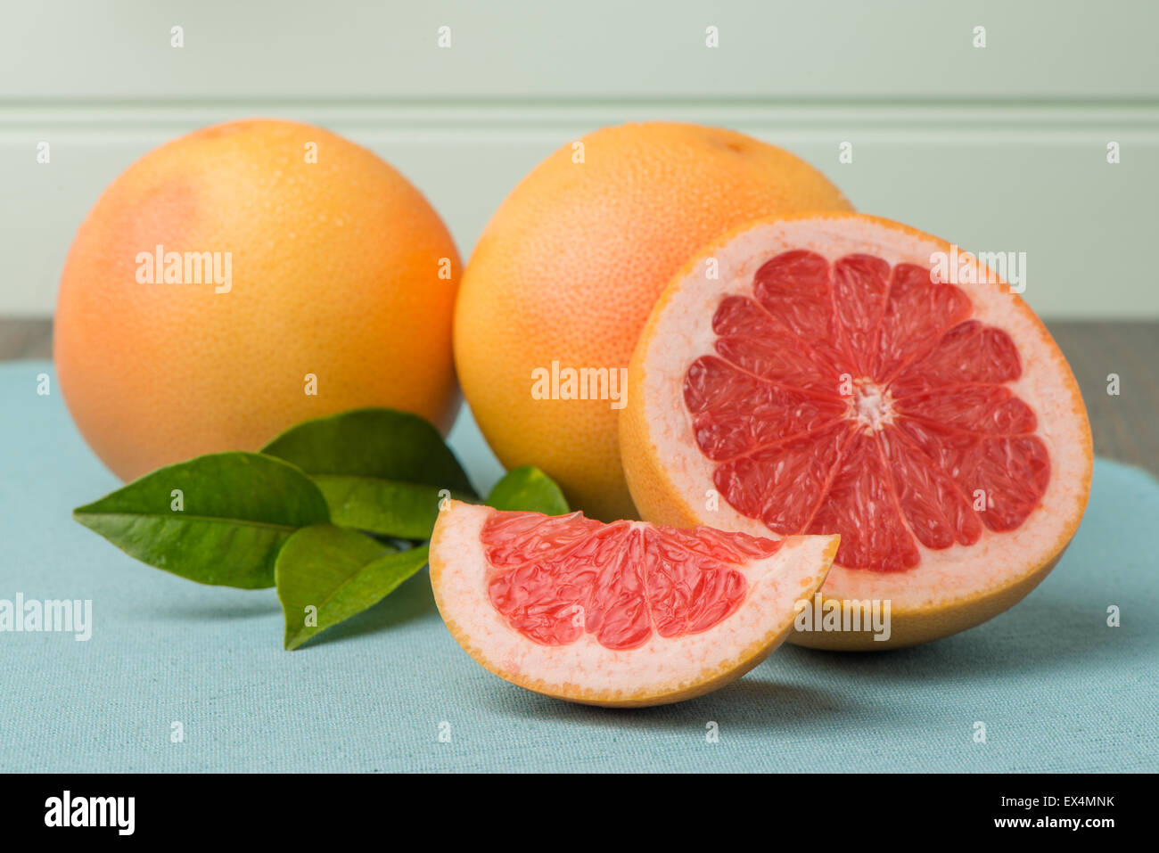 Ripe grapefruit close-up on wooden table background Stock Photo - Alamy