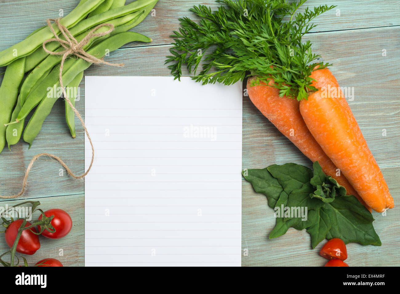 Blank white paper and fresh colorful vegetables on kitchen table Stock ...