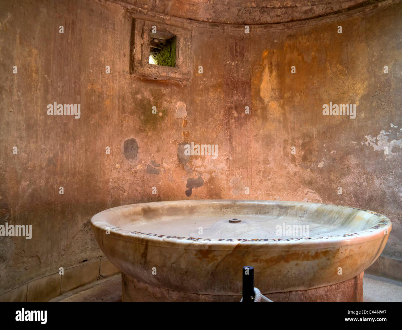 Lustral Bowl in the Mens baths in the once buried Roman city of Pompeii ...