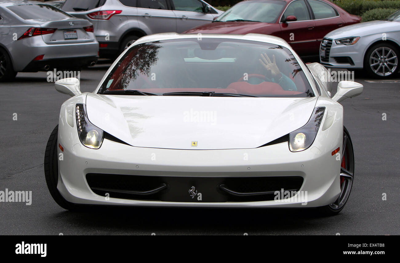 Rod Stewart out with his wife driving his white Ferrari 458 Spider in ...