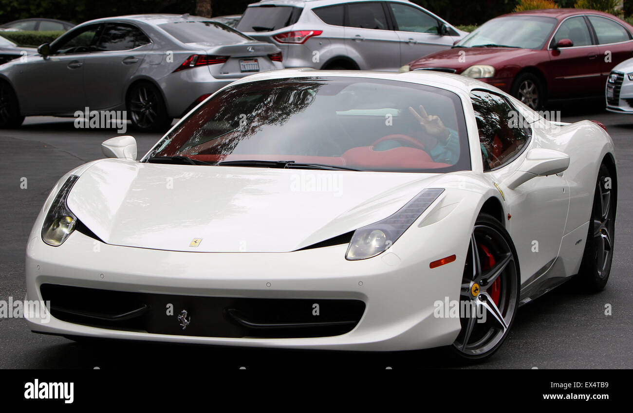 Rod Stewart out with his wife driving his white Ferrari 458 Spider in ...