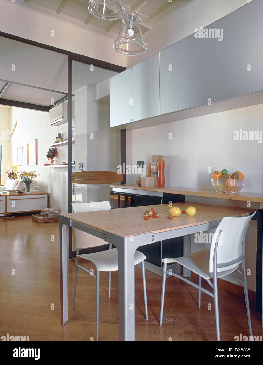 interior view of modern kitchen overlooking on living room with wood ...