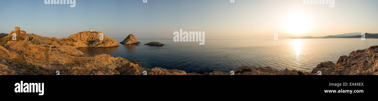 Panoramic view of the Genoese tower and lighthouse on the red rock at ...