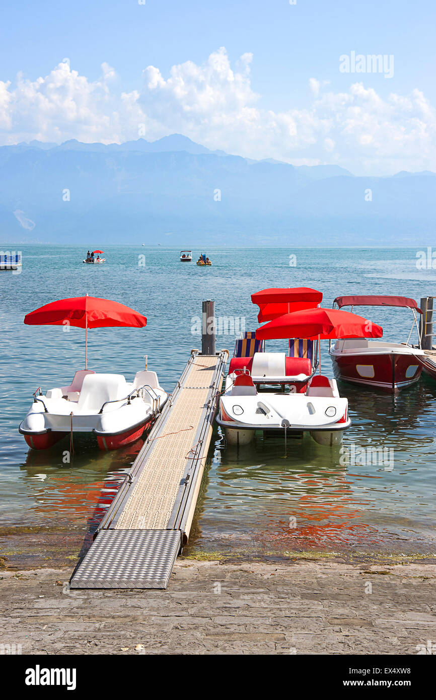 Red catamarans in Geneva lake bay harbor in Lausanne, Switzerland in ...