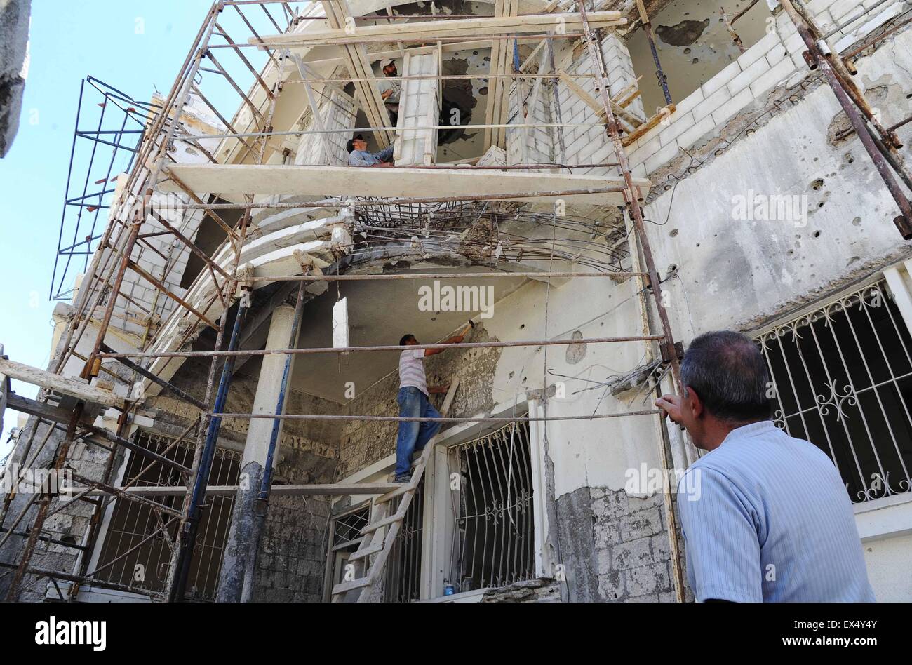 Rebuilding shattered homes hi-res stock photography and images - Alamy