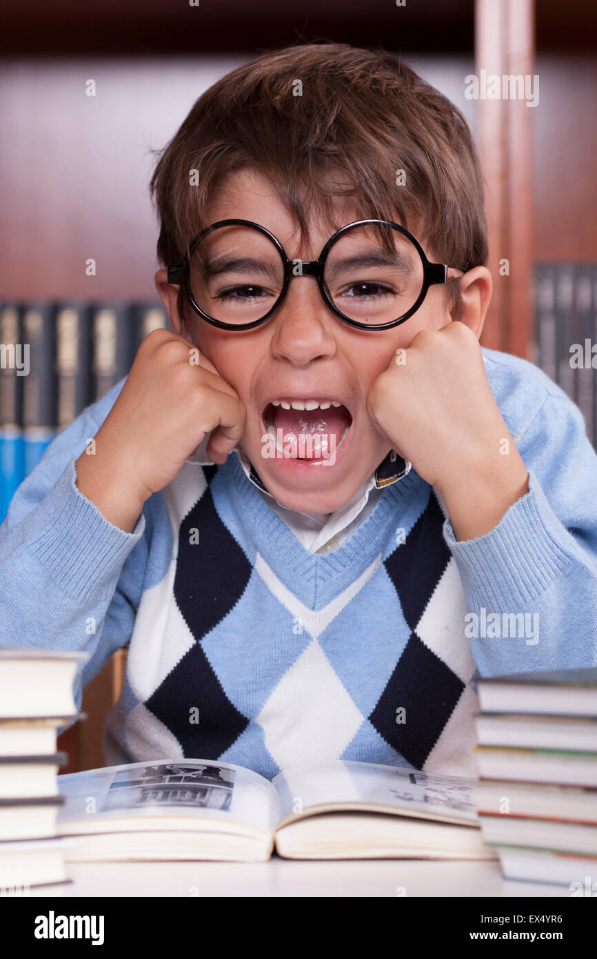 Child studying in the library Stock Photo - Alamy