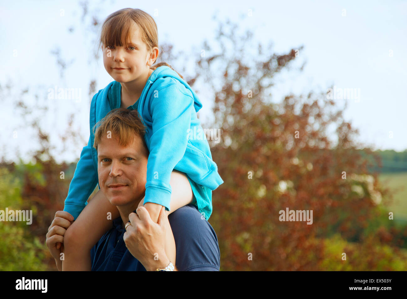 Father carrying daughter on shoulders hi-res stock photography and images - Alamy