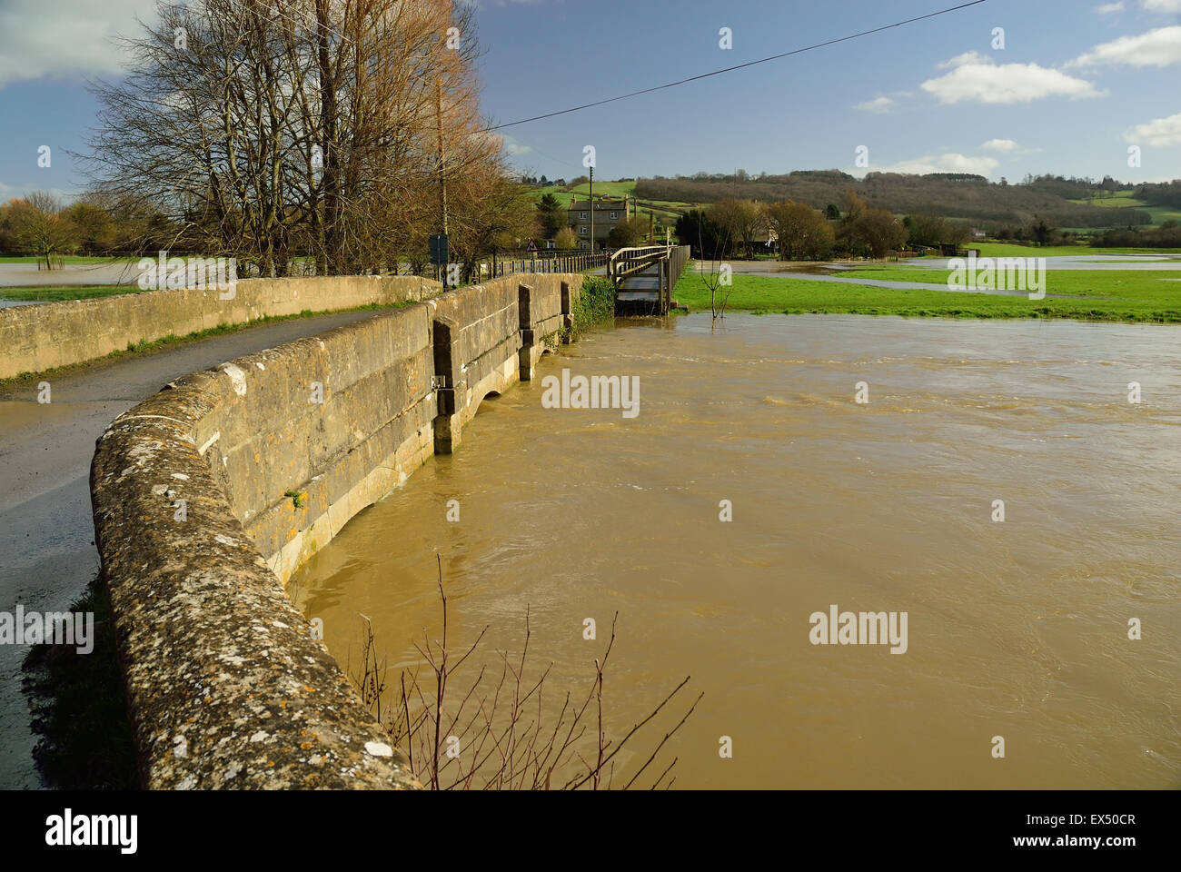 Bridge over the swollen river Avon, and raised pedestrian walkway ...